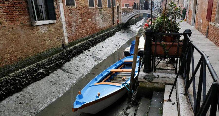 Drought And Low Tides Cause Venetian Canals To Run Dry
