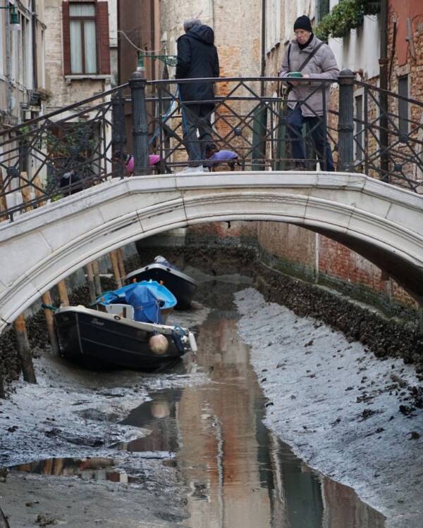 Drought And Low Tides Cause Venetian Canals To Run Dry